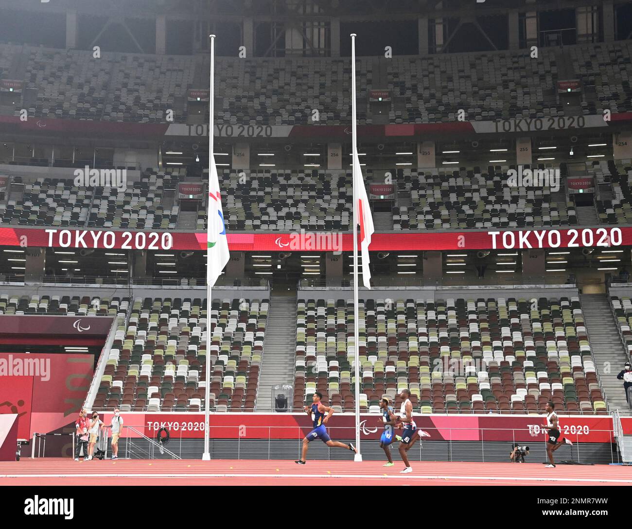 Paralympic three agitos flag (L) and Japanese National flag are flying ...