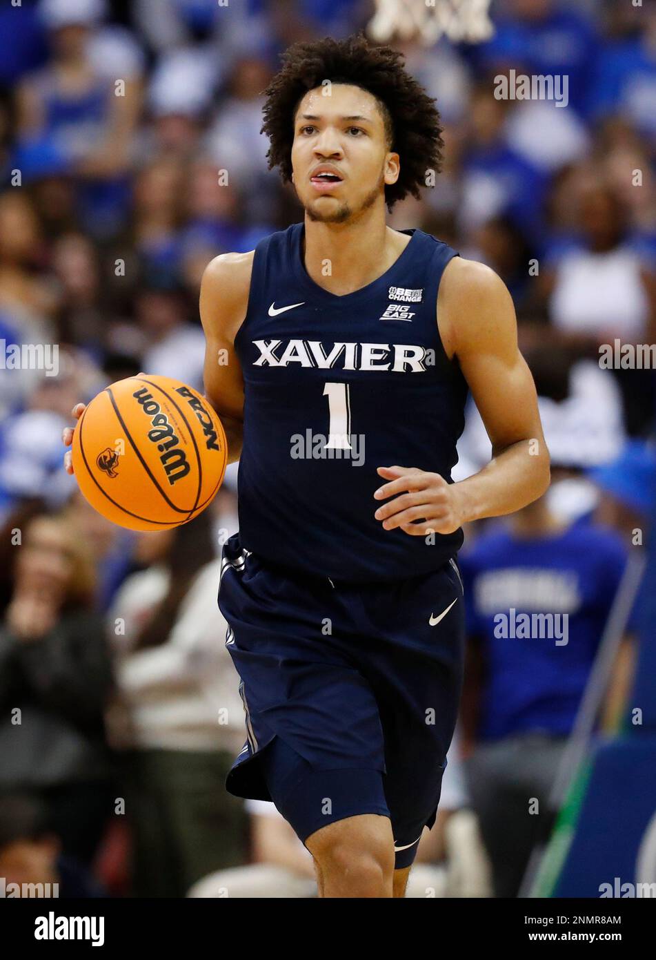 Xavier guard Desmond Claude (1) dribbles the ball against Seton Hall ...