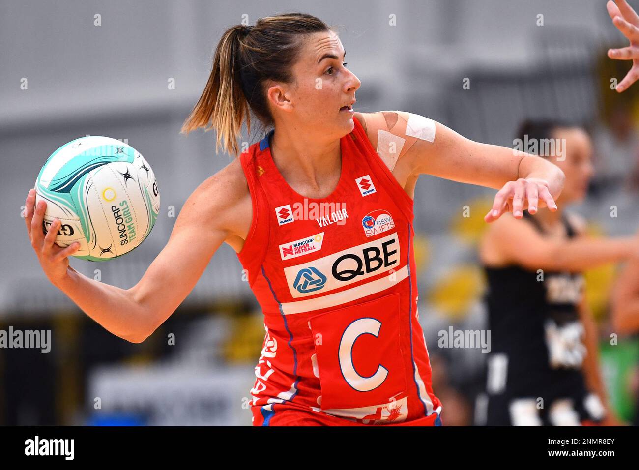 Maddy Proud of the Swifts passes the ball during the Super Netball pre ...