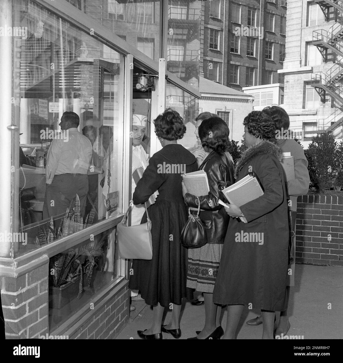African American women attempt to enter The Coffee Shop, a segregated ...