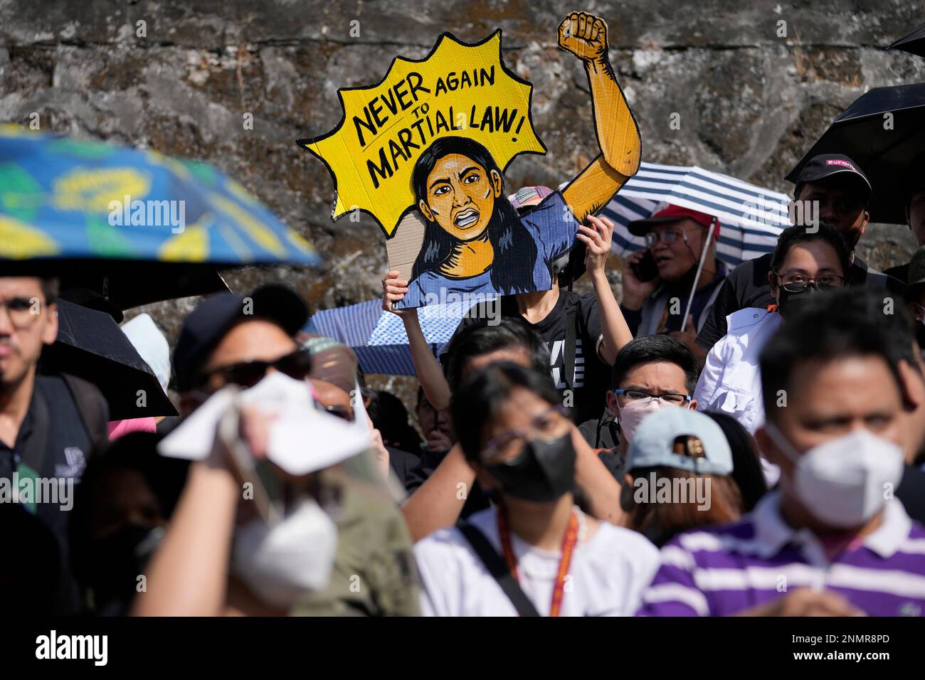Protesters hold a slogans during a rally to observe the 37th ...