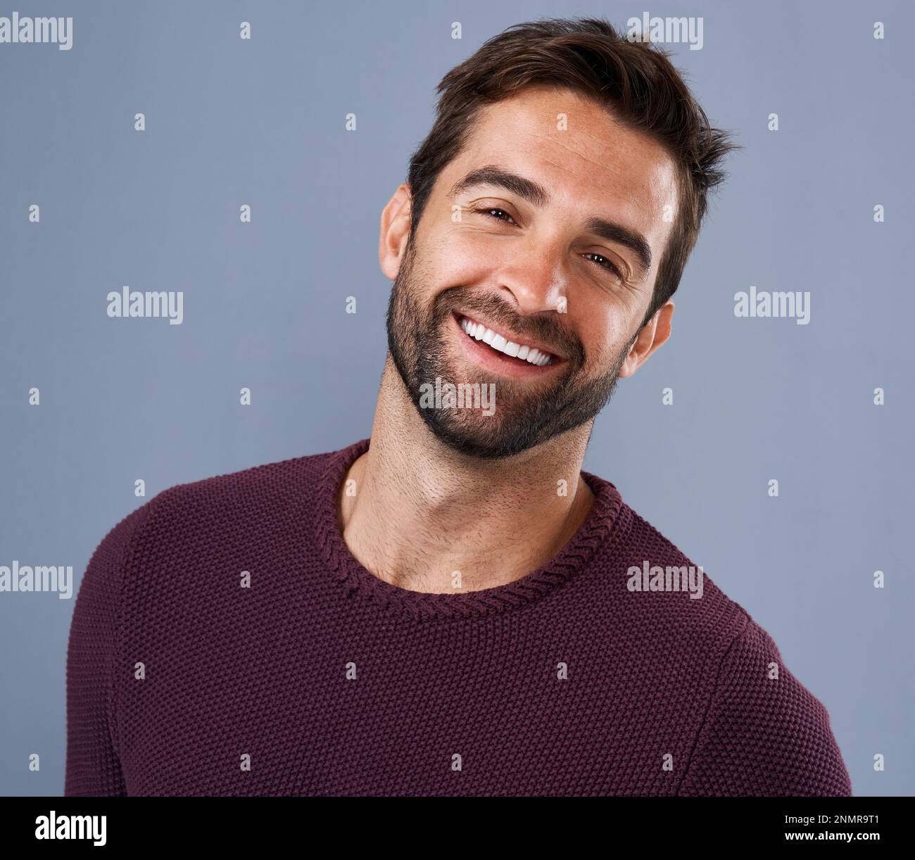 The smile to beat all smiles. Studio shot of a handsome and happy young ...
