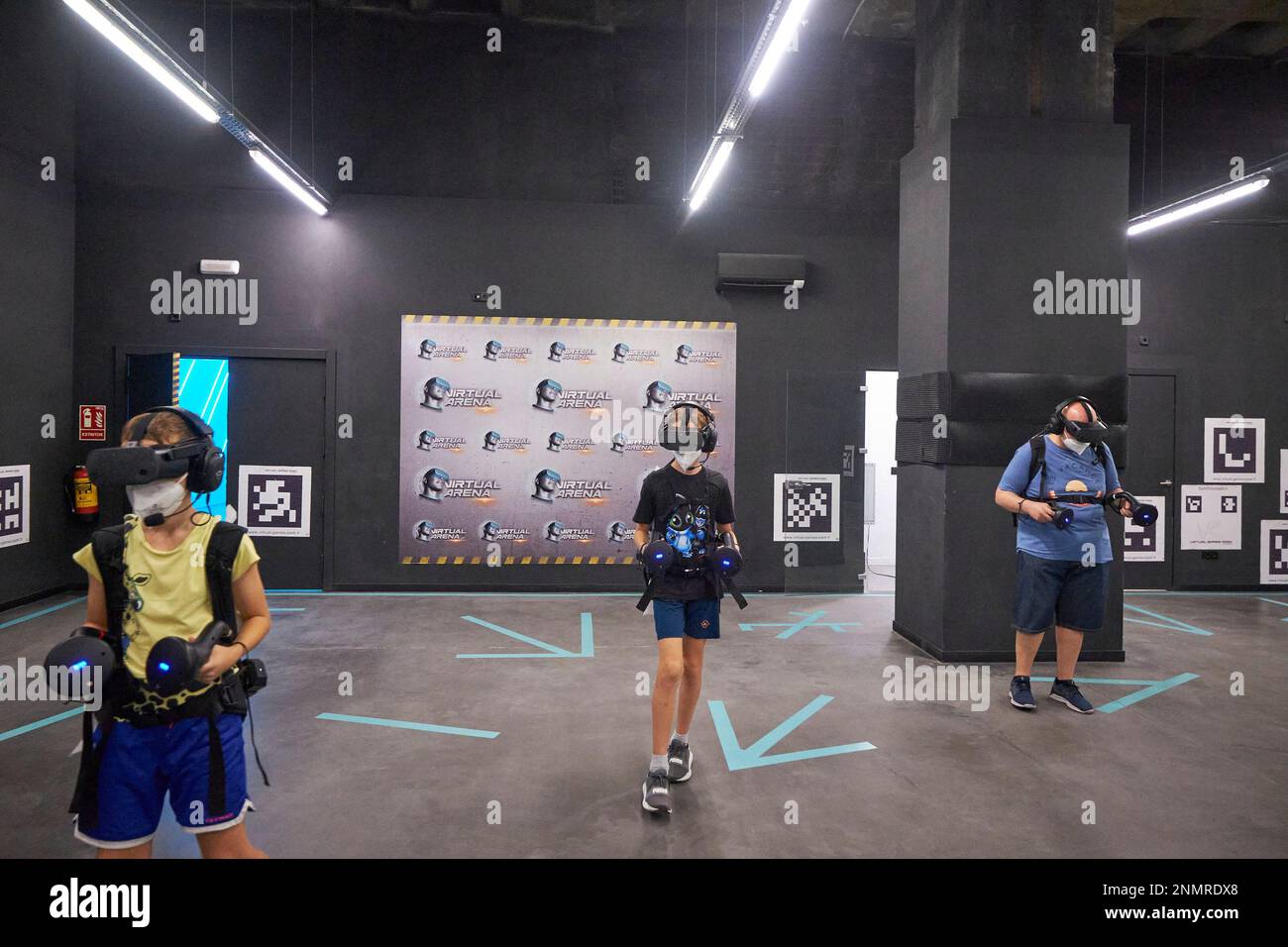 Several people participate in a virtual reality game at the Virtual ...