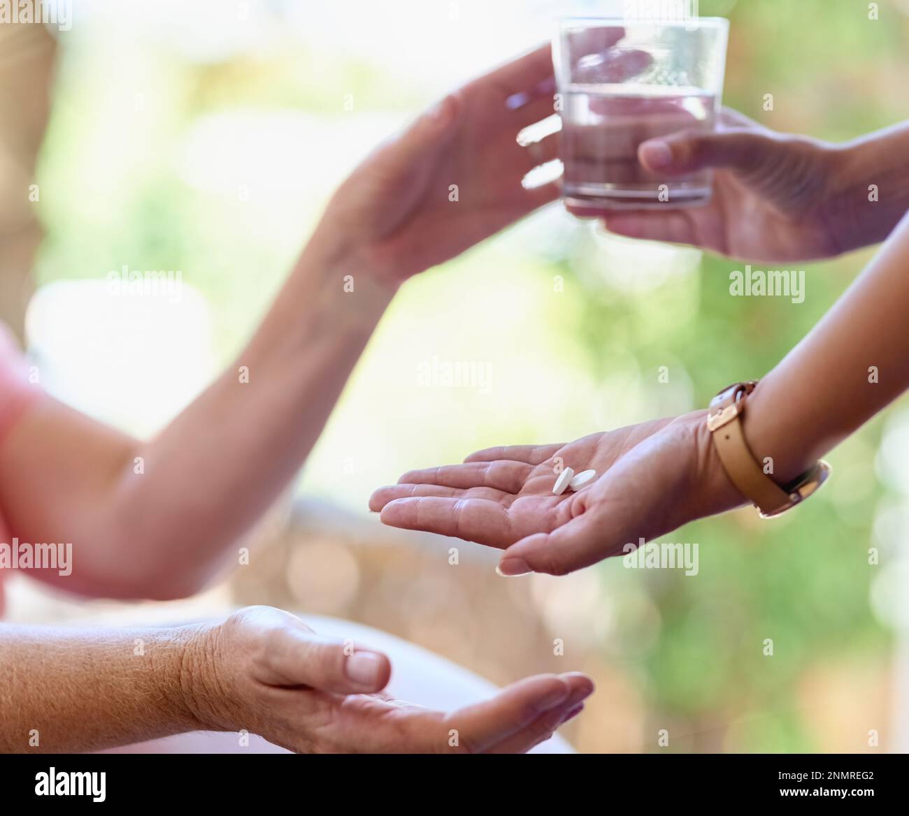Time for your meds. a nurse giving medication and a glass of water to a ...