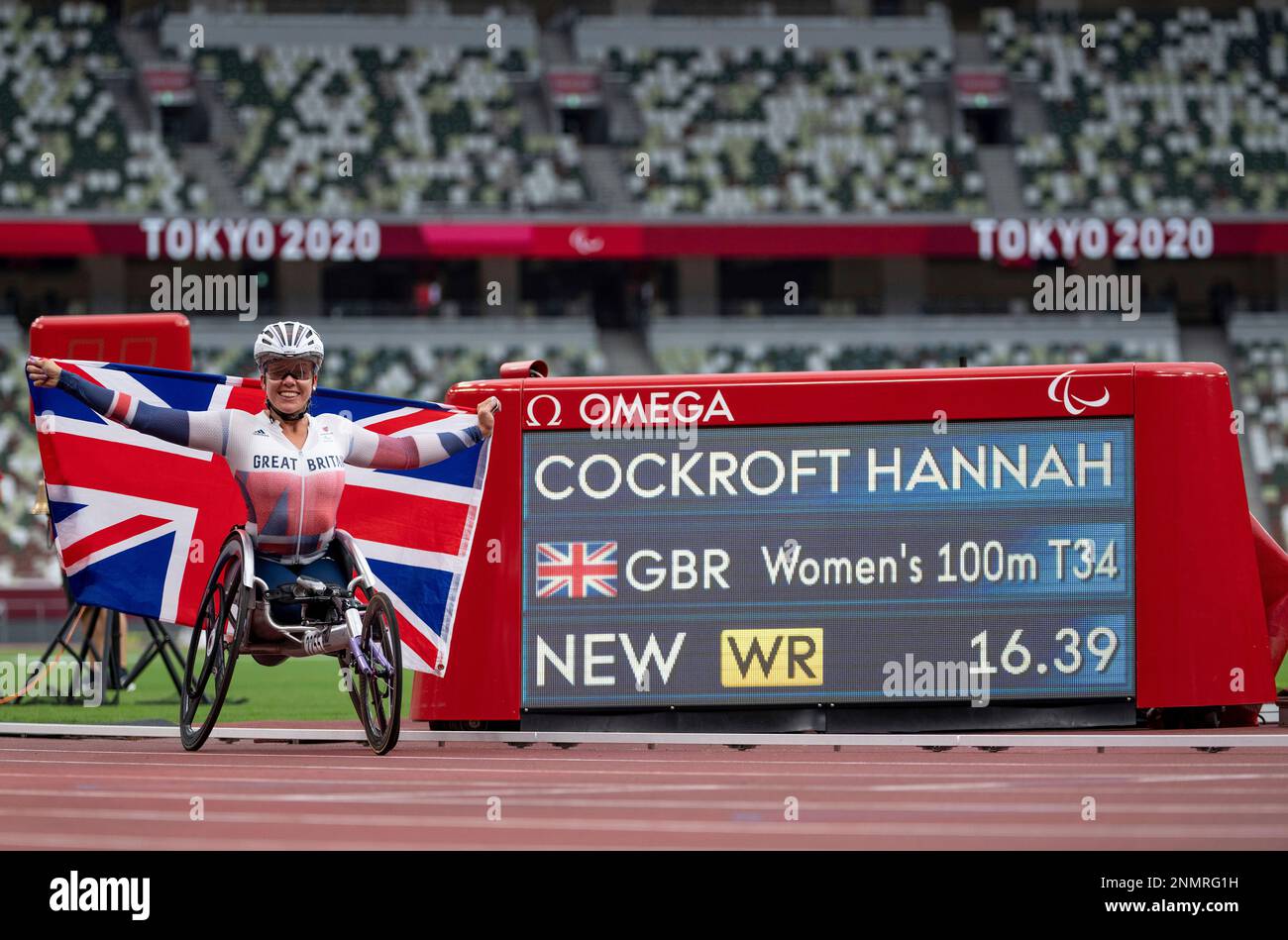 Hannah Cockroft of Britain poses next to the timing board showing her ...