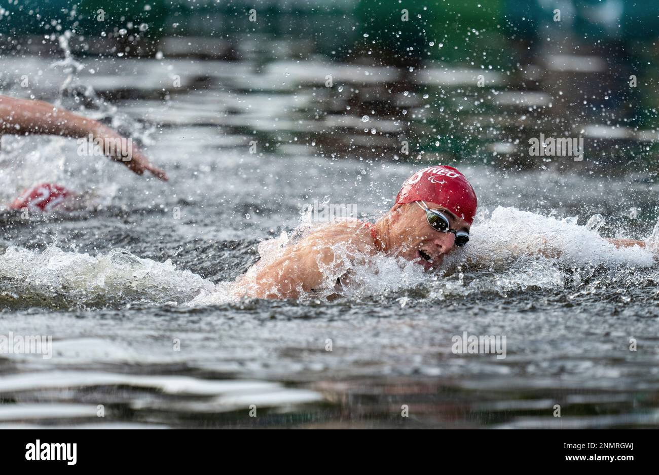 Jetze Plat, of the Netherlands, starts the swim portion of the men's ...