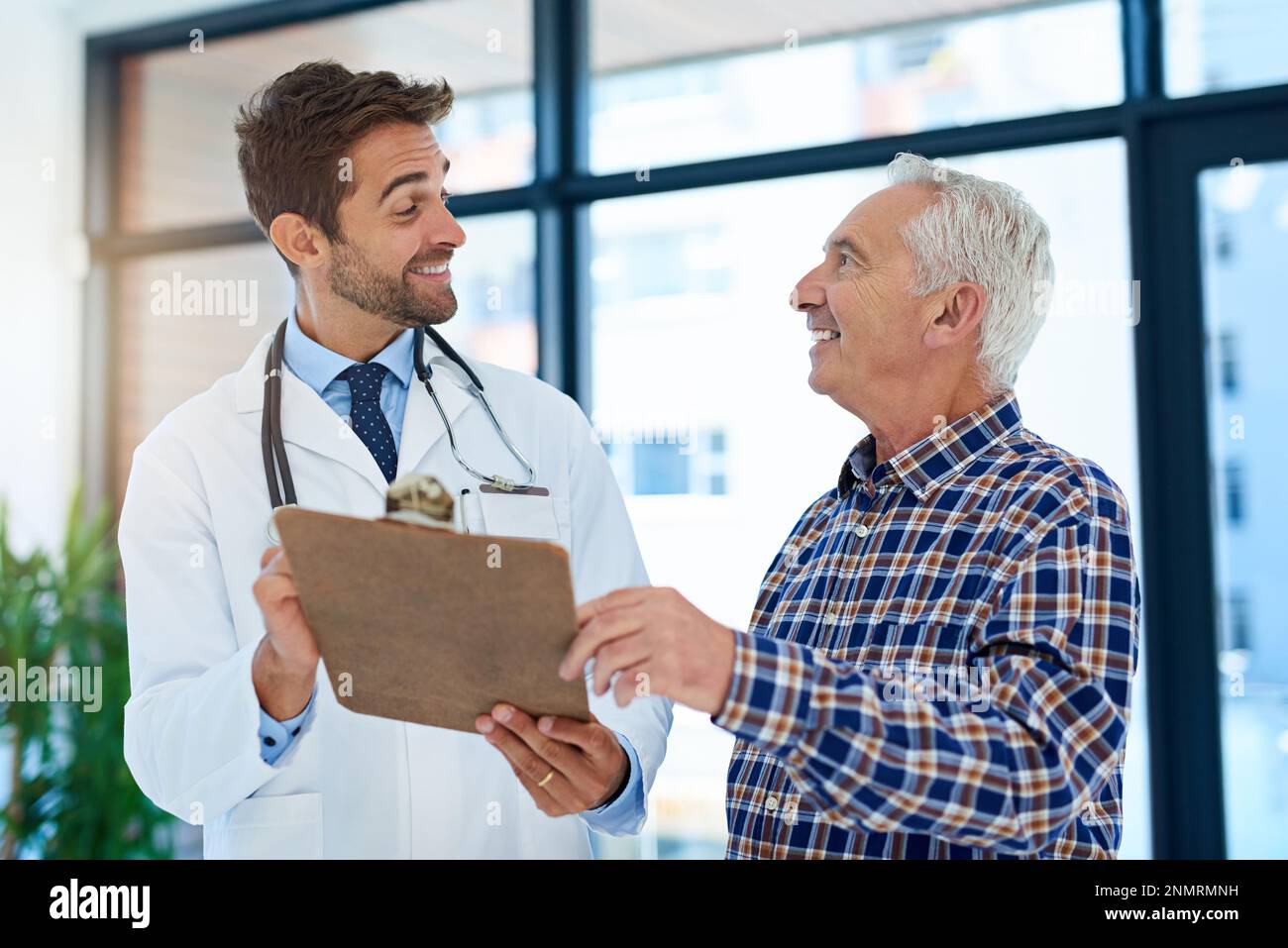 These results are worth smiling about. a cheerful doctor sharing good ...