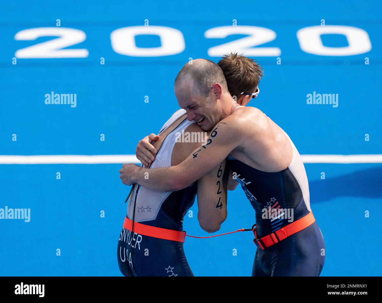 United States' Brad Snyder and his guide Greg Billington react after ...