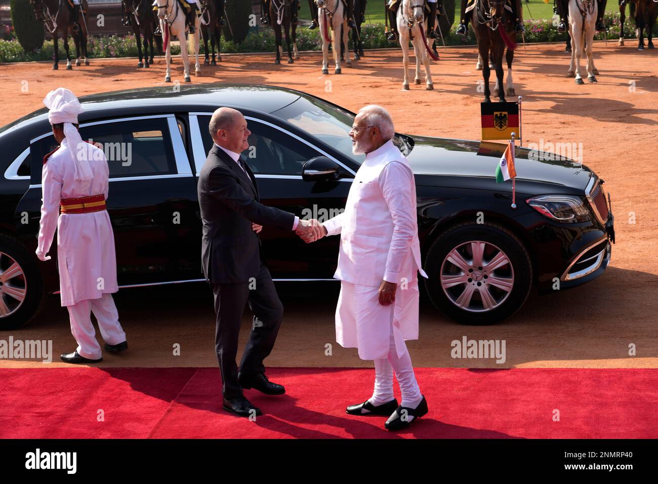 Indian Prime Minister Narendra Modi, right, welcomes German Chancellor Olaf Scholz, during ...