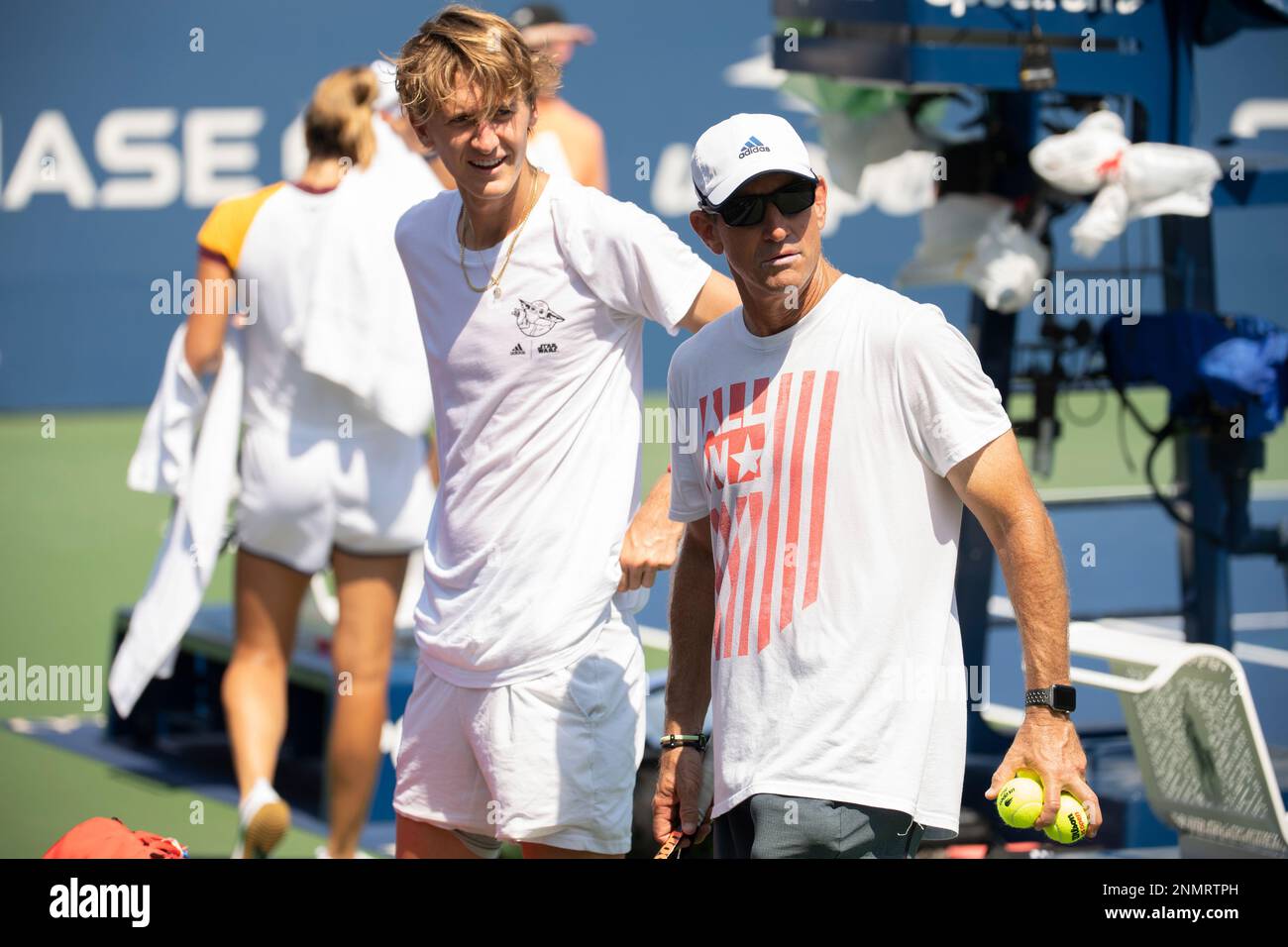 Sebastian Korda stands with his coach, Dean Goldfine, during practice ...