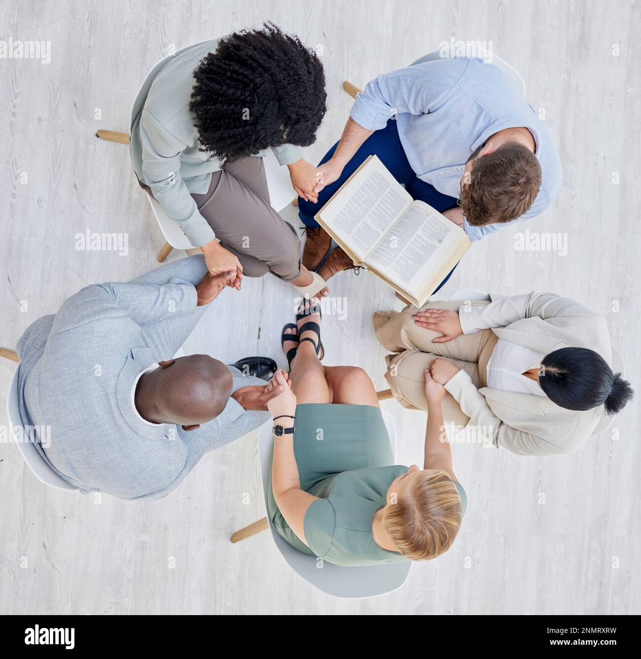 Prayer group, circle nd people holding hands above for religion support ...
