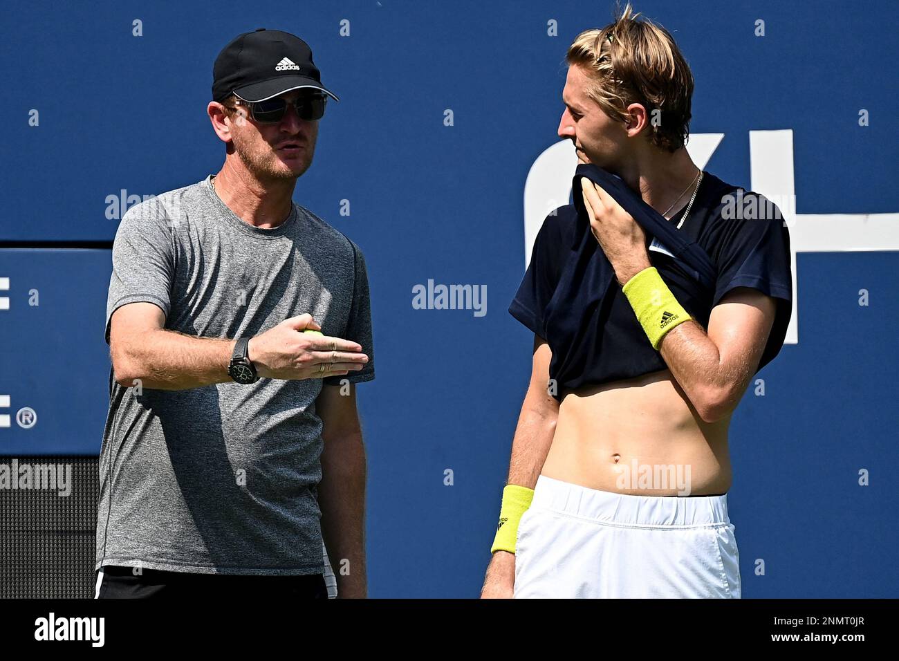 Sebastian Korda talks to his coach Dean Goldfine during practice at the ...