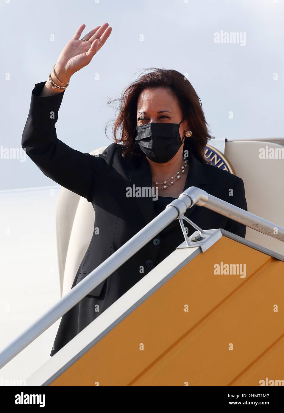 U.S. Vice President Kamala Harris waves as she boards Air Force Two as ...