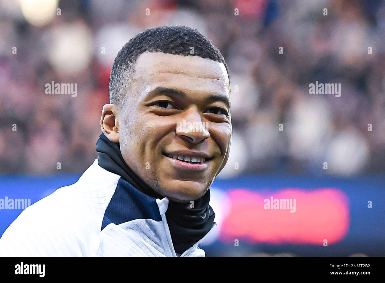 Kylian Mbappe smiles during the public training of the Paris Saint ...