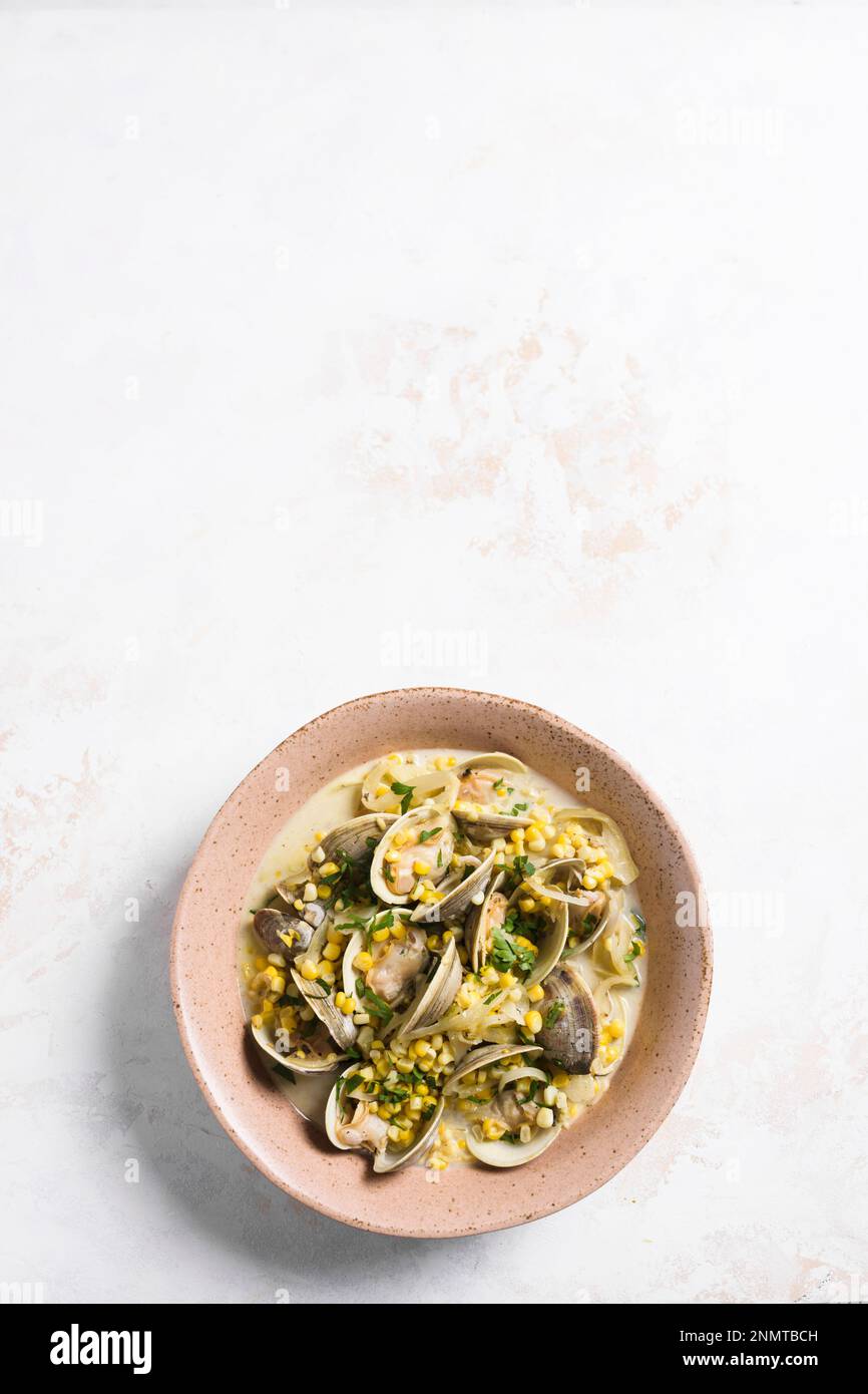 This image released by Milk Street shows a recipe for steamed clams ...