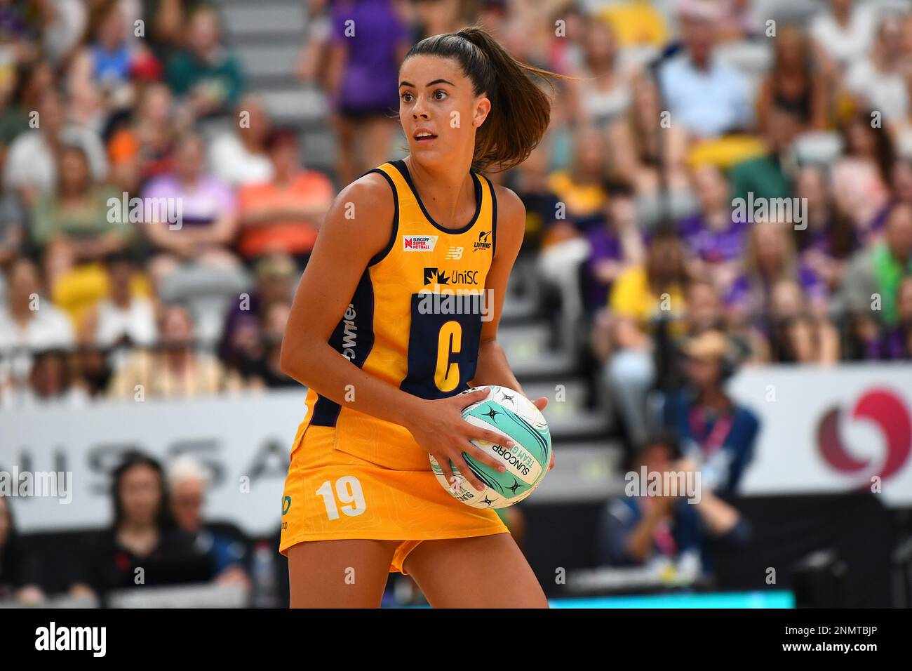 Ava Black of the Lightning looks to pass during the Super Netball pre ...