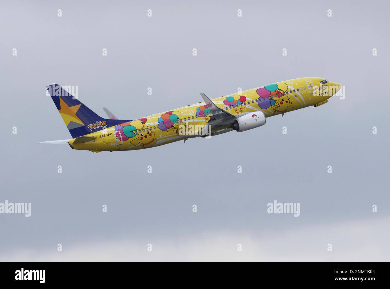 An airplane that is adorned with Pokémon, Pikachu Jet, flies in Tokyo ...