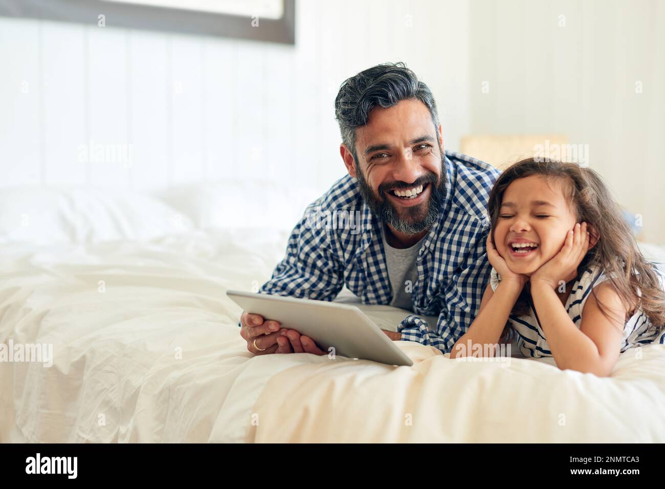 Introducing her to the wonders of technology. Portrait of a father and ...