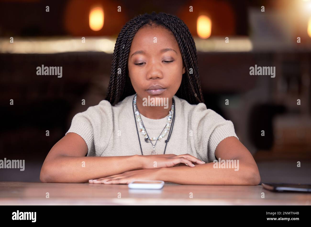 Depression, sad and woman with phone in coffee shop during breakup or ...