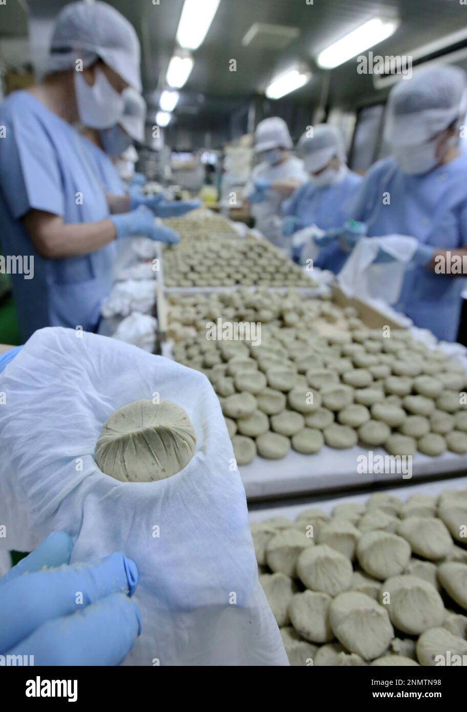 The cooking of Kurikinton, a sweetened mixture of boiled and mashed ...
