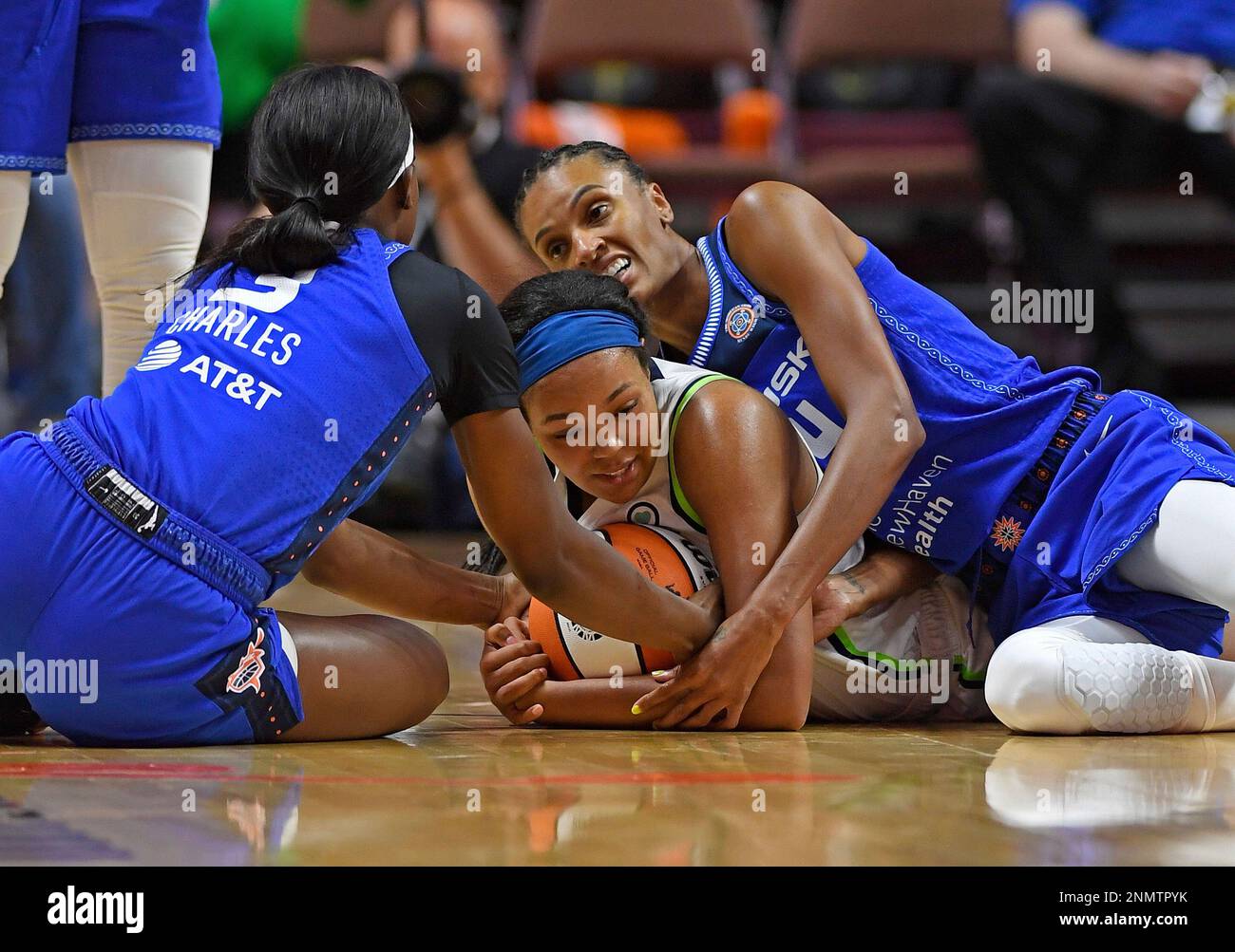 Connecticut Sun defenders Kaila Charles, left, and DeWanna Bonner race ...
