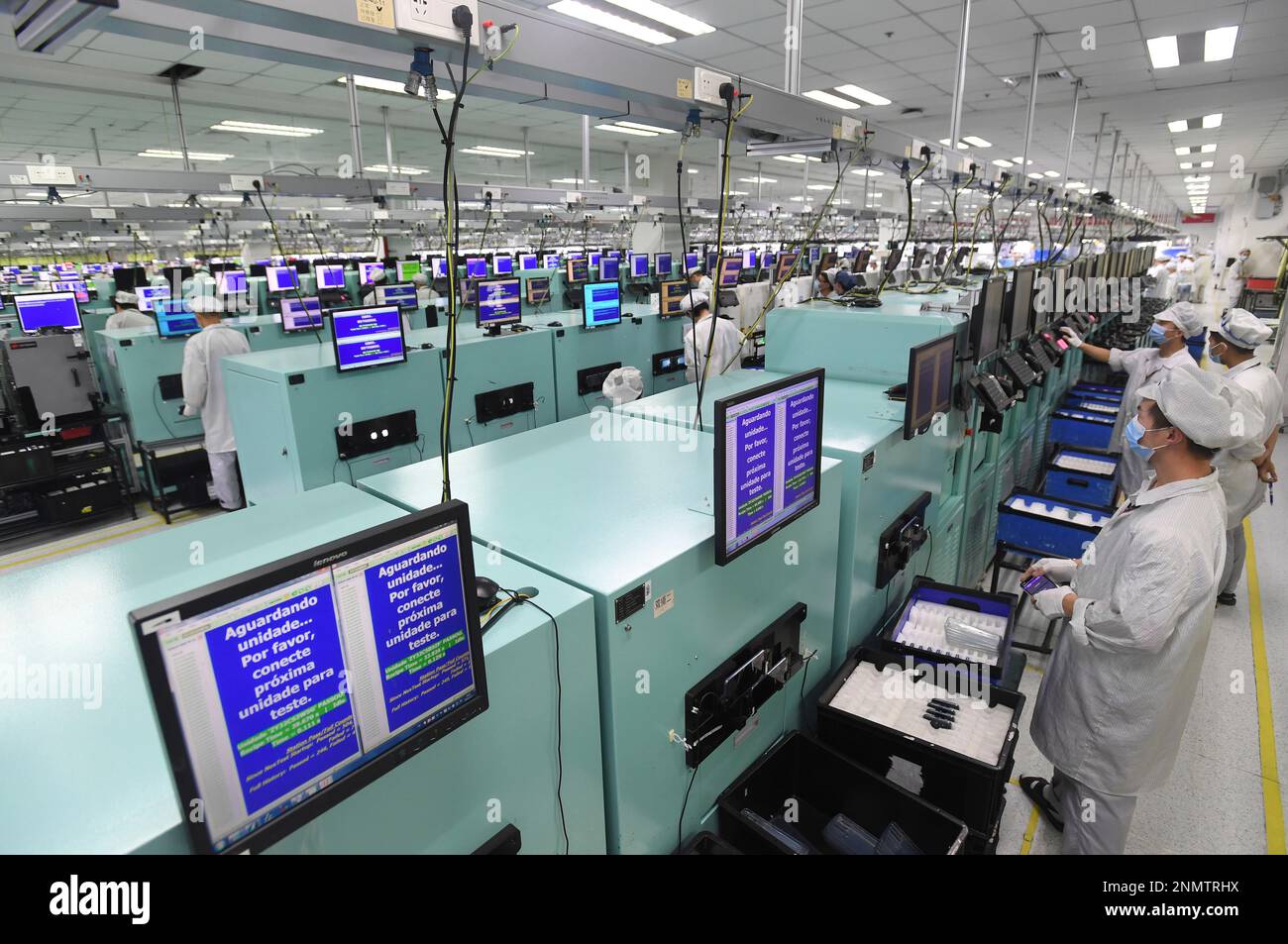 People work at a plant of Lenovo and Motorola phones in Wuhan in ...