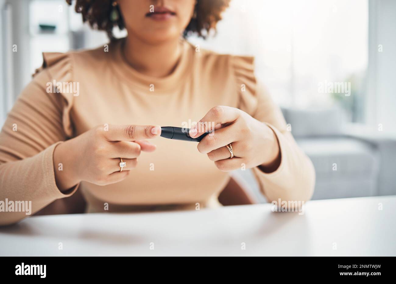 Diabetes, finger of black woman and blood test in hands, healthcare and ...