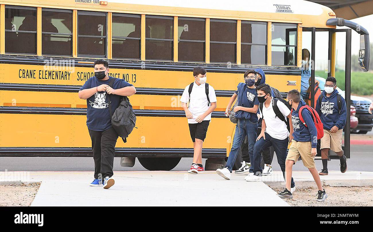 Crane Middle School student get off the bus, Wednesday, July 28, 2021 ...