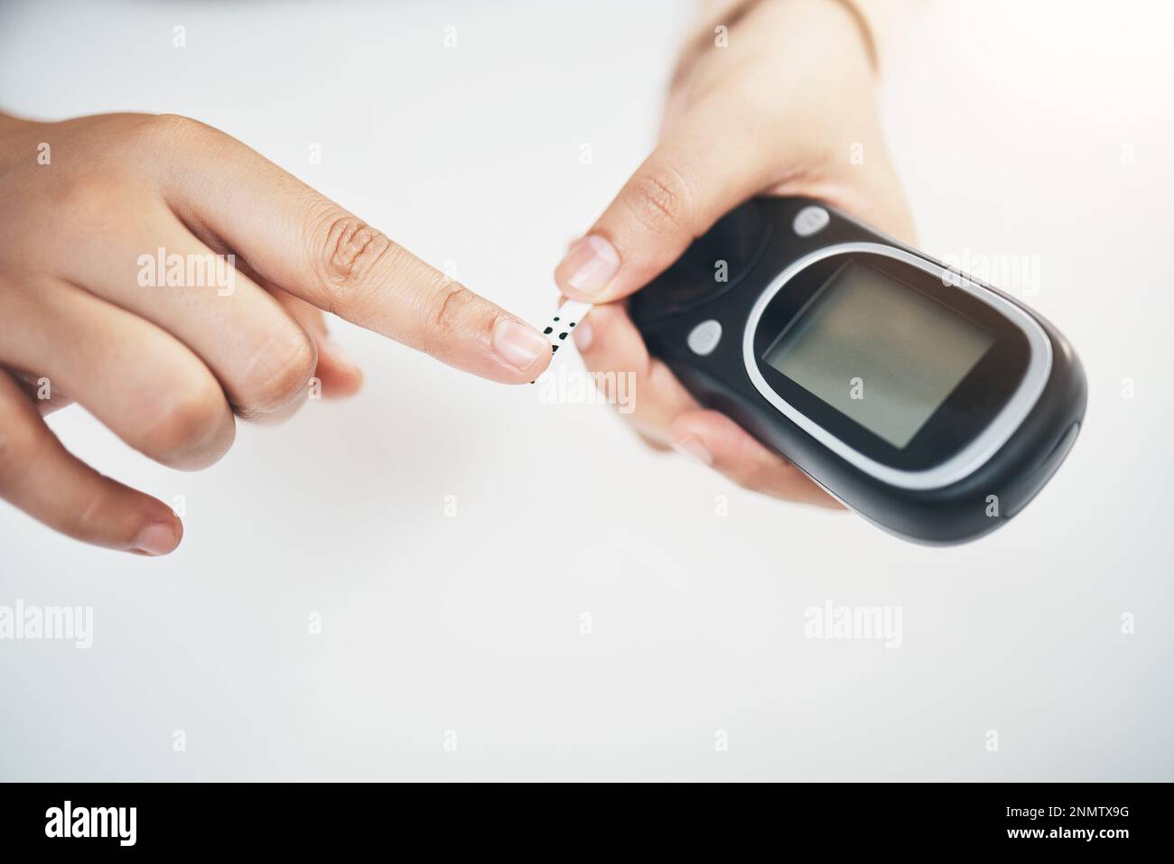 Diabetes, hands of black woman and blood test strip on finger ...