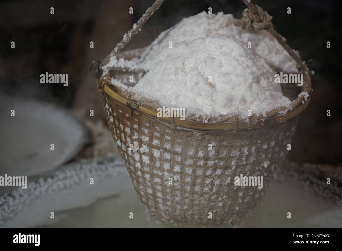 boiling saline solution in pan is traditional way for making mountain ...