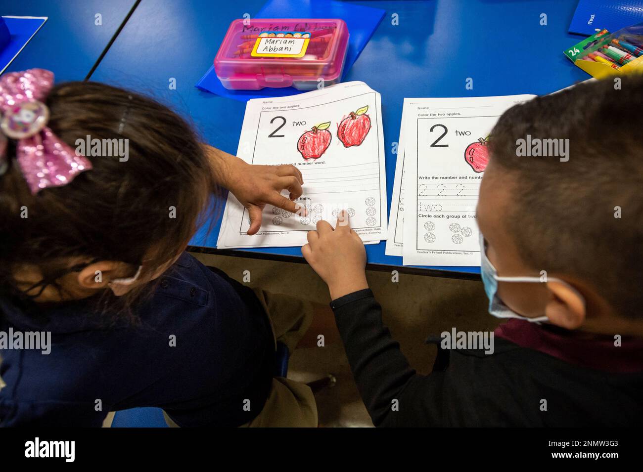 Kindergartners work together on their class assignment at Repetto ...