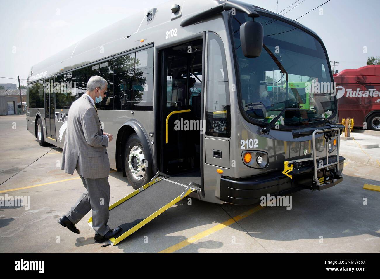 Tulsa Transit General Manager Ted Rieck boards a new electric bus ...