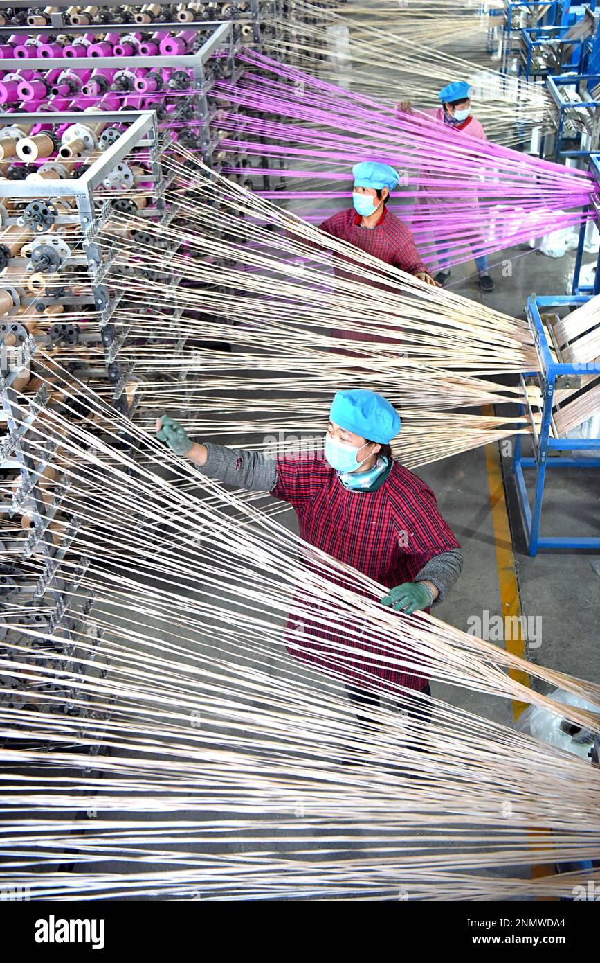 Zibo, China's Shandong Province. 23rd Feb, 2023. Women work at a ...