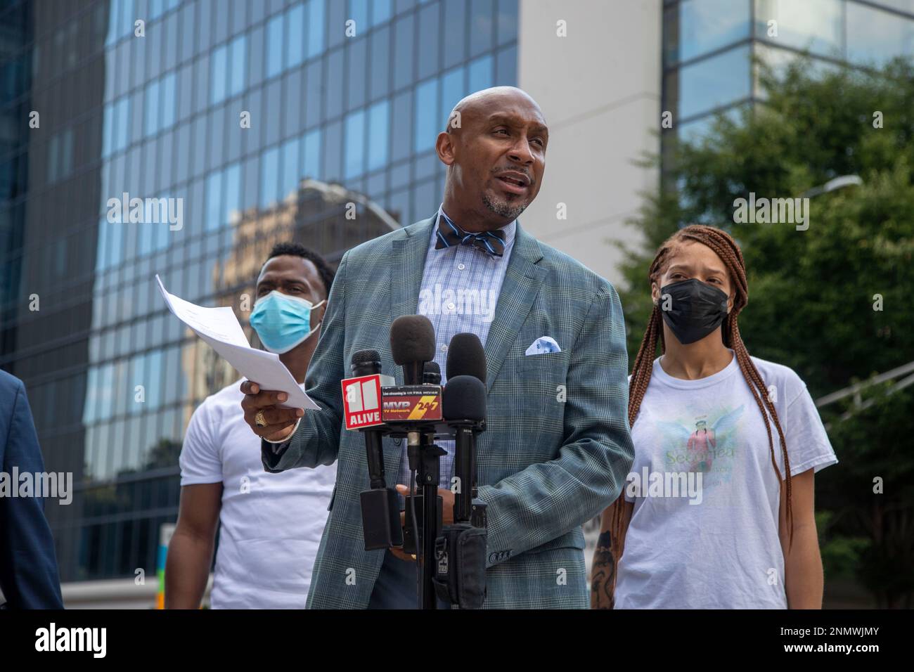 Attorney Mawuli Davis speaks during a news conference outside of the ...