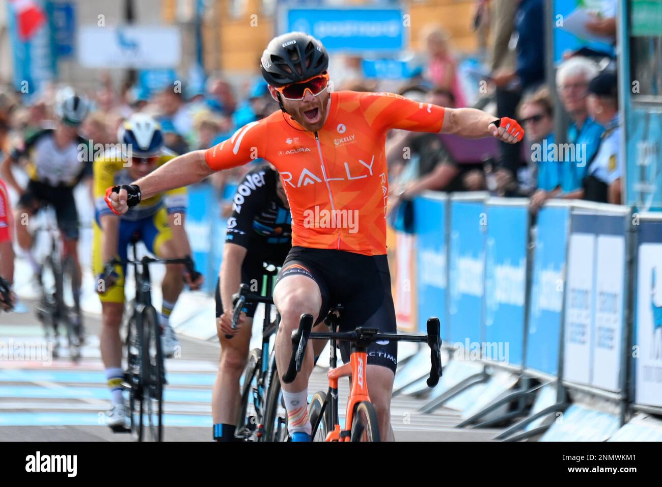 Colin Joyce of the United States crosses the finish line to win the ...