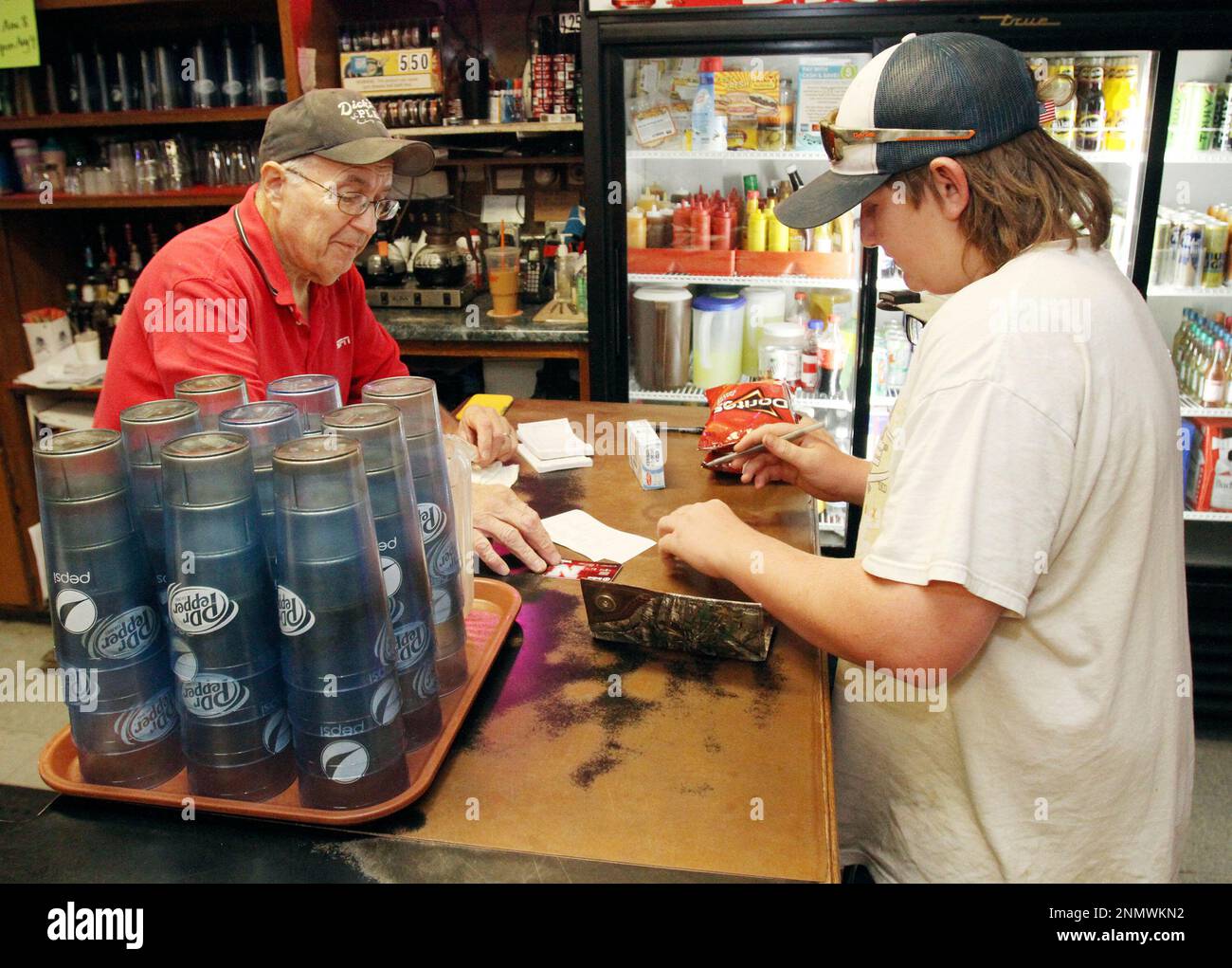 In this Thursday, Aug. 5, 2021, photo, William Schaefer buys some ...