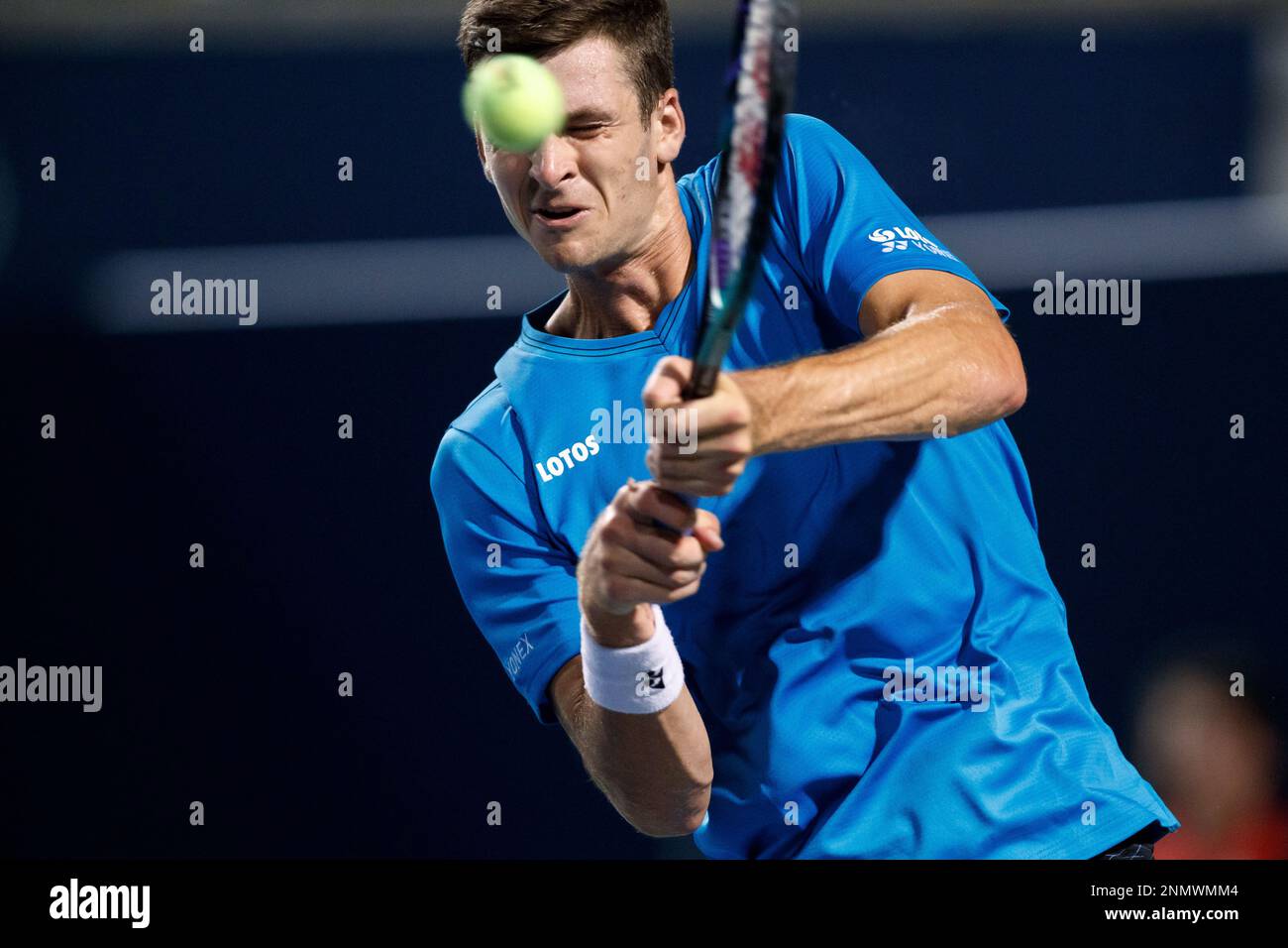 Hubert Hurkacz, of Poland, hits a return to Nikoloz Basilashvili, of ...