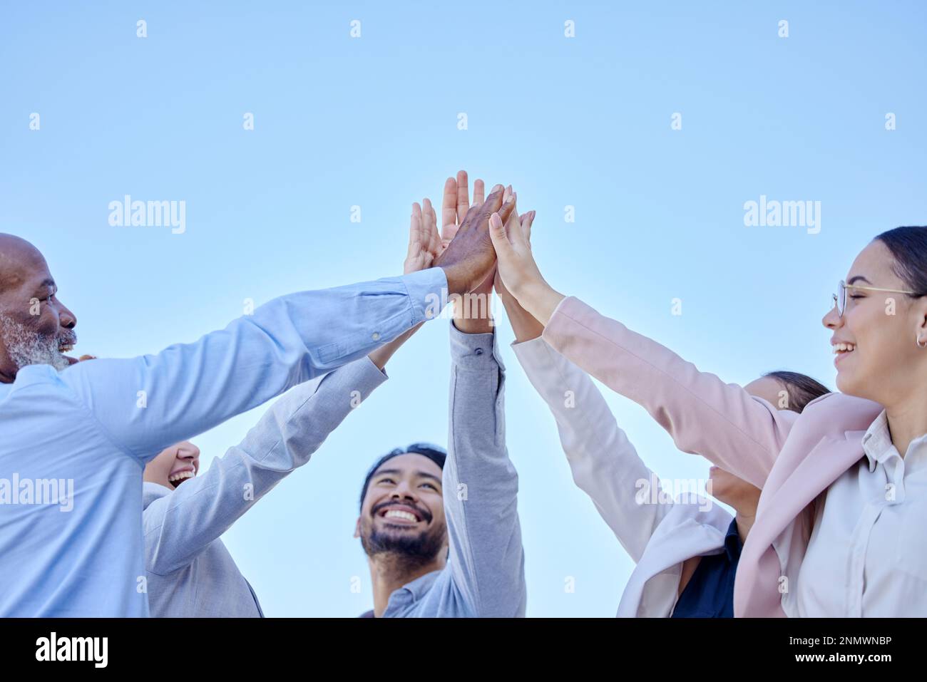 Happy, high five and support with hands of business people for community, diversity and teamwork ...
