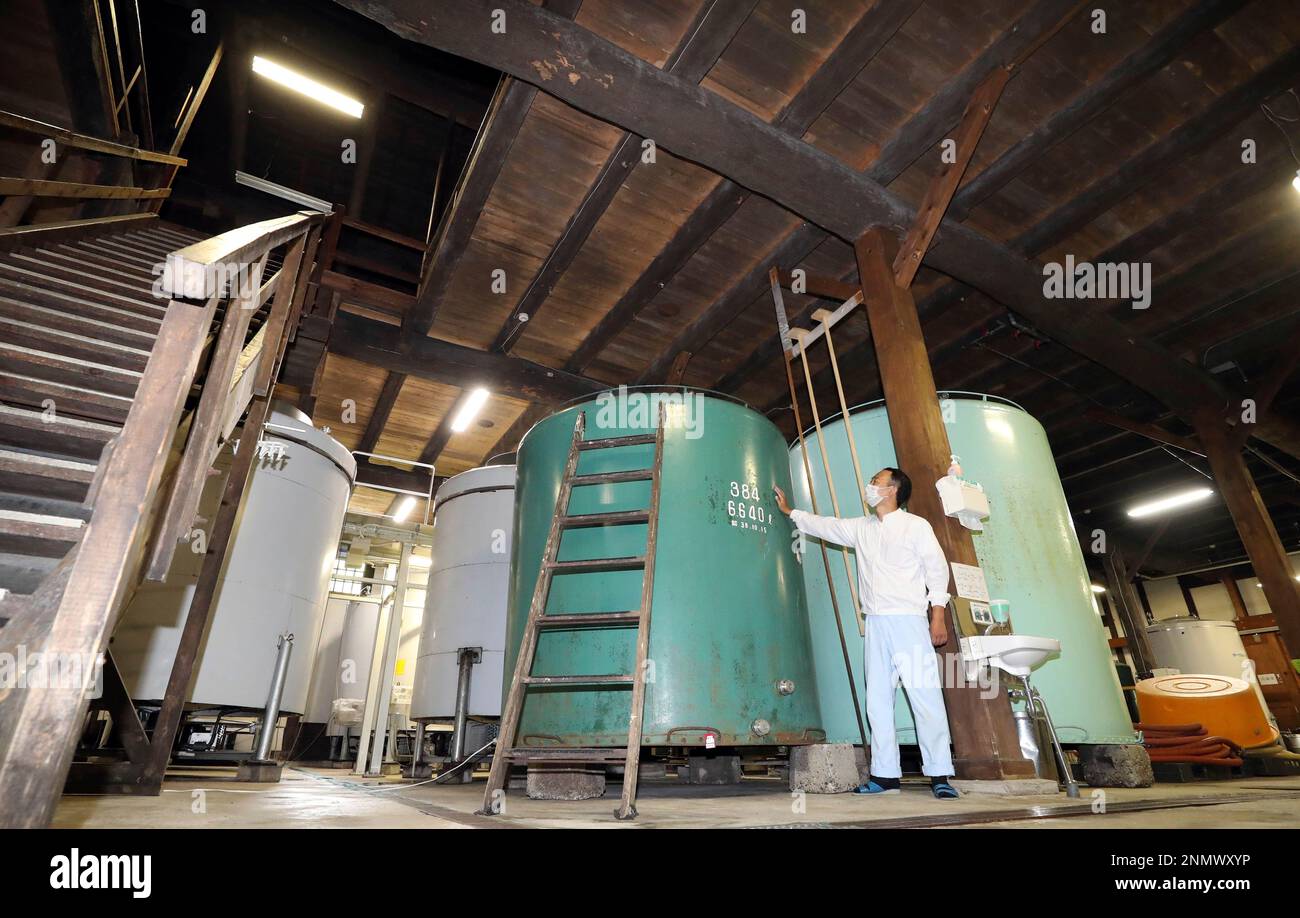 A picture taken on July 27, 2021 shows tanks for sake at a Japanese ...