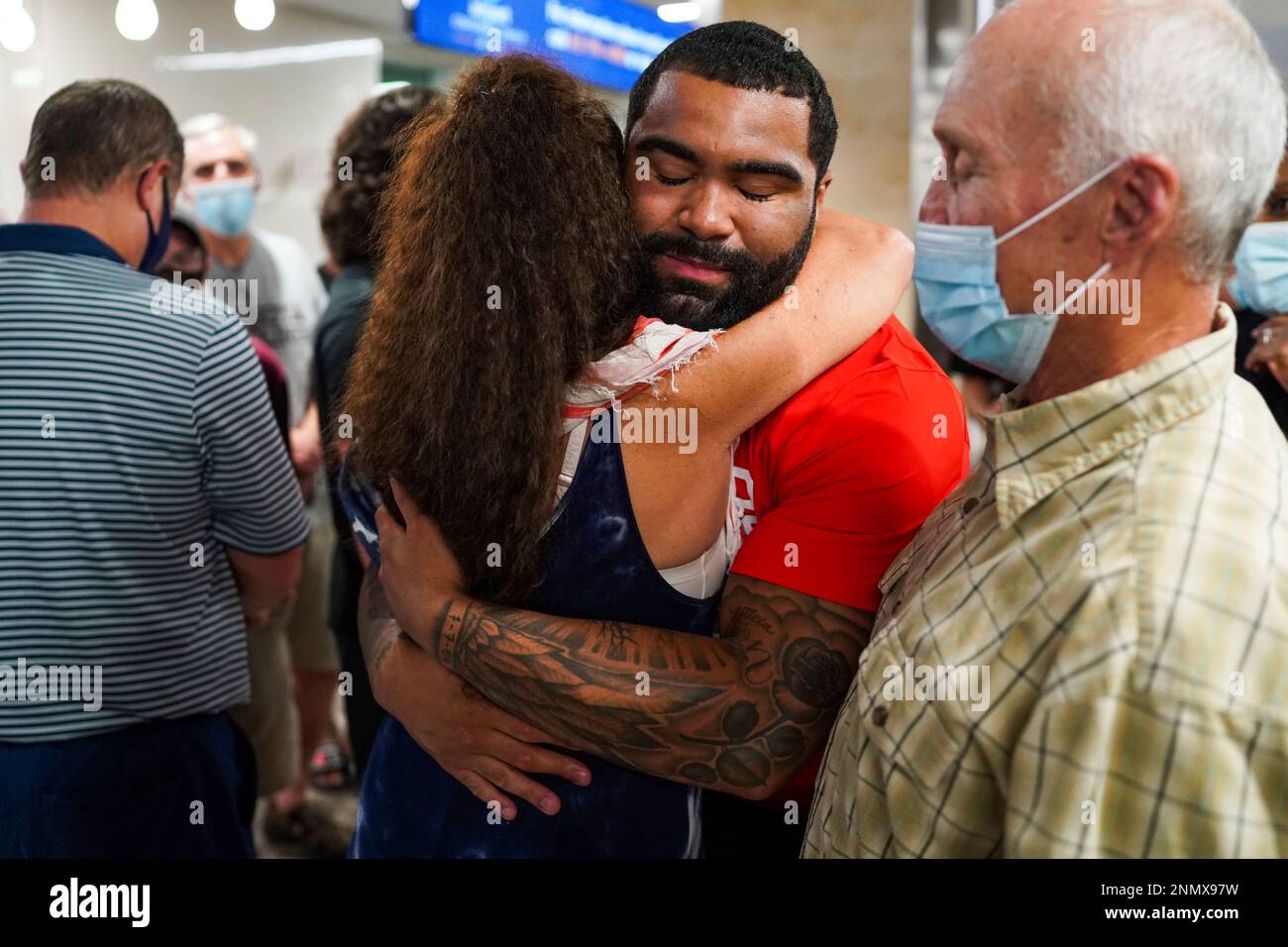 Olympic gold medal wrestler Gable Steveson hugs a fan as he is welcomed ...