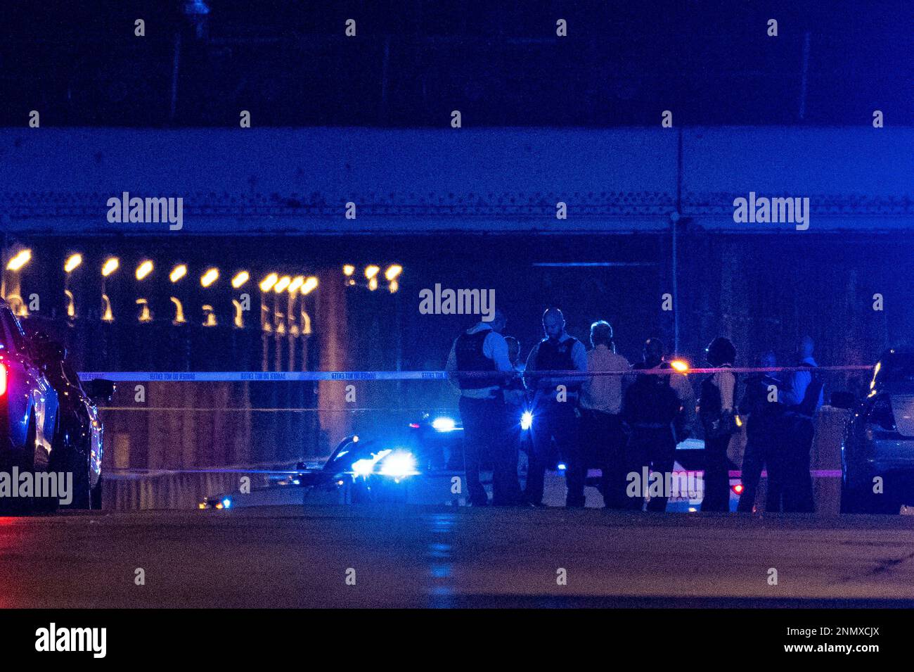 Chicago police work the scene where two police officers where shot ...