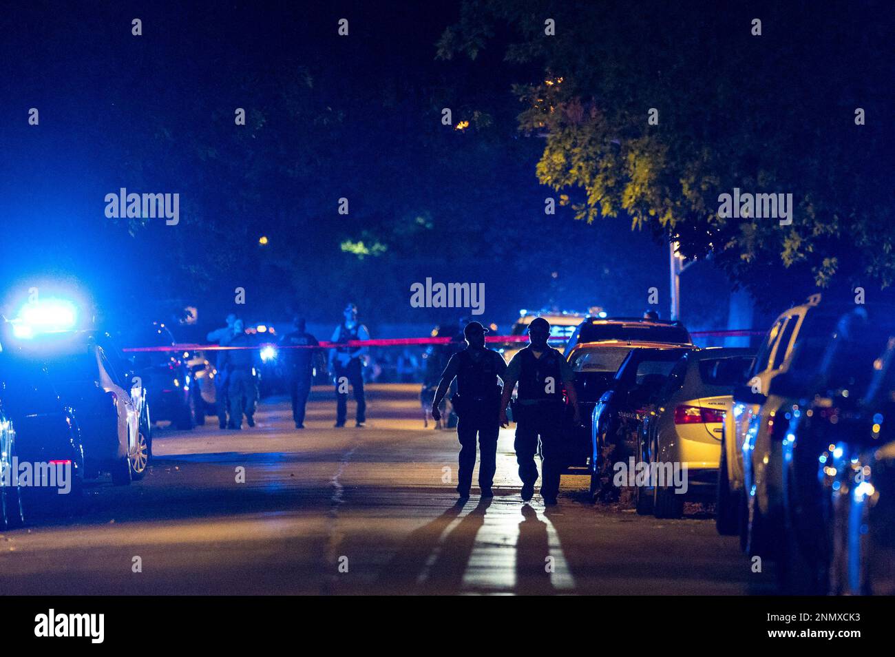 Chicago police work the scene where two police officers where shot ...