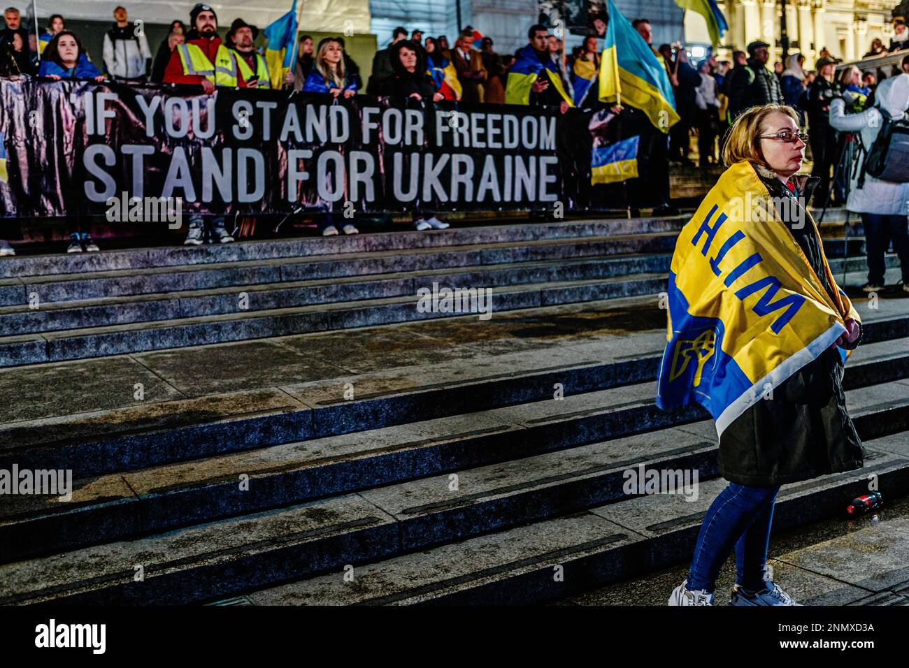 Activist hold up sign for Ukraine at a vigil in Trafalgar Square to ...