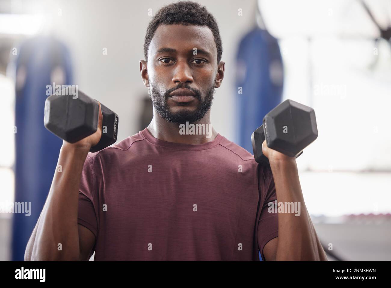 Black man, portrait and dumbbell workout in gym for strong power ...