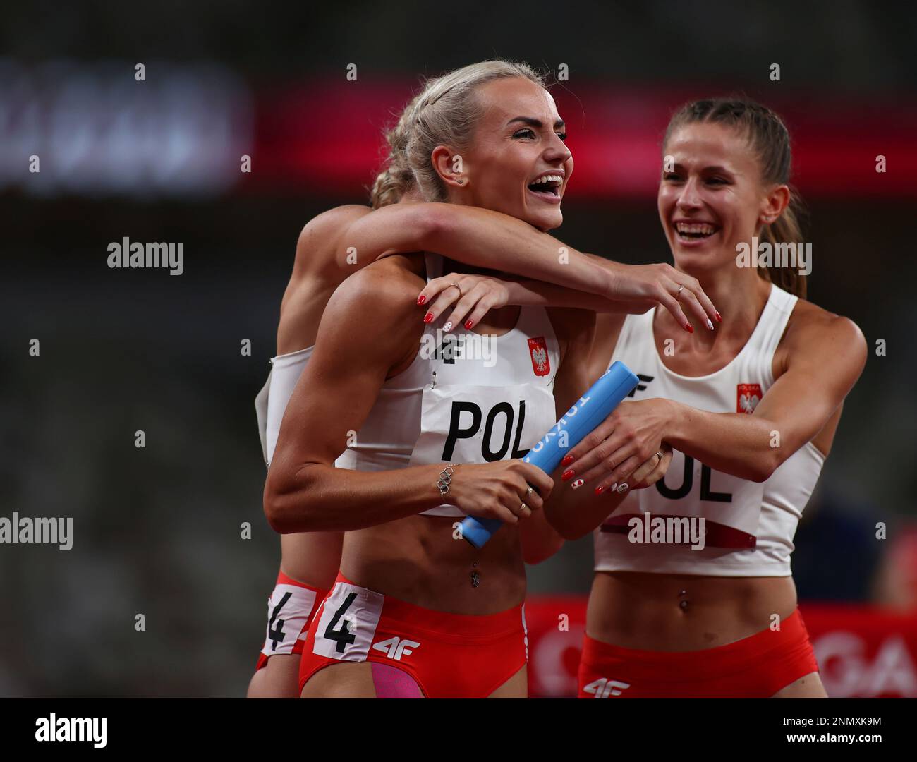 Members of Poland celebrate after winning Athletics women's 4x400m ...