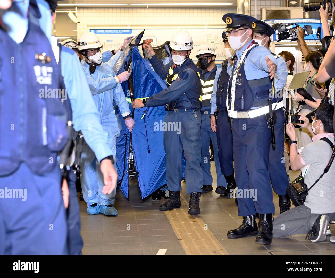 Rescuers carry a stretcher, believed to be carrying an injured ...