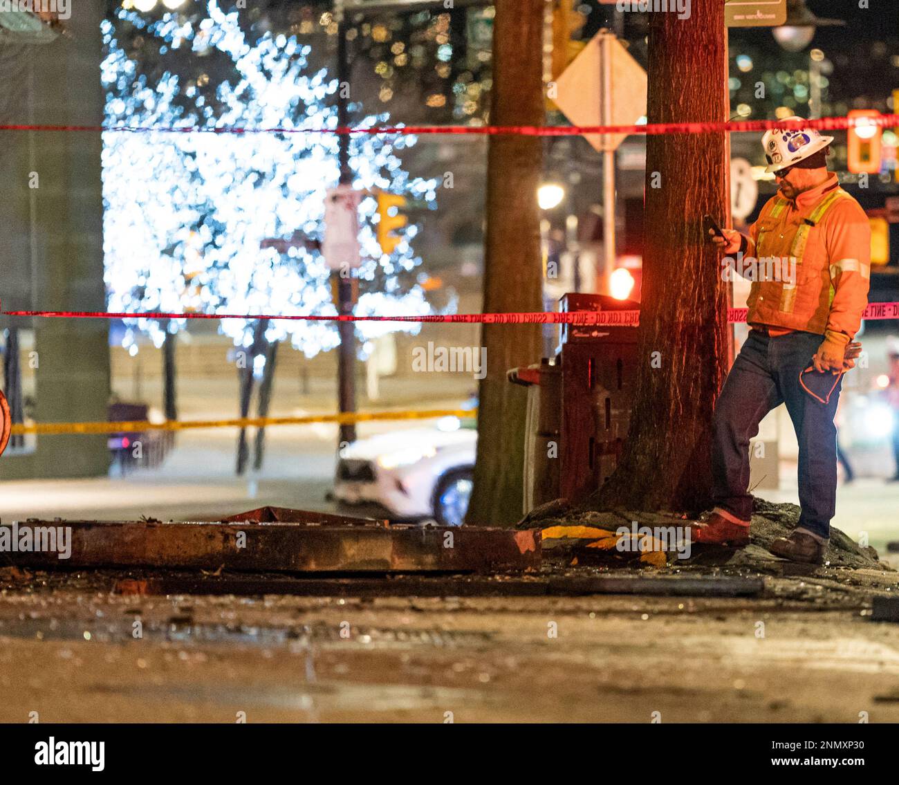 Canada. 24th Feb, 2023. A hydro worker takes a photo of an underground ...