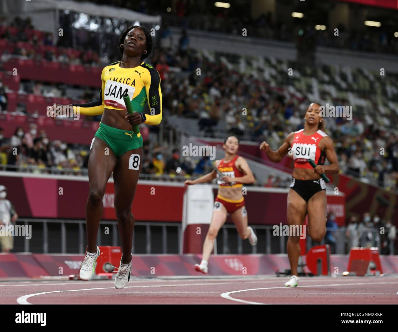 Jamaica's team WILLIAMS Briana ( L, 8 lane) crosses the finish line during the Women's ' 4 x100 ...