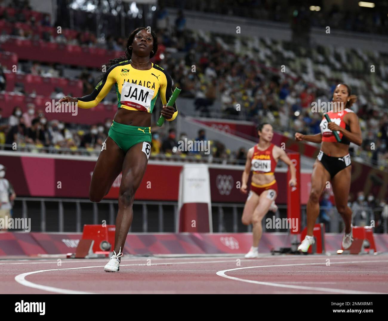 Jamaica's team WILLIAMS Briana ( L, 8 lane) crosses the finish line during the Women's ' 4 x100 ...
