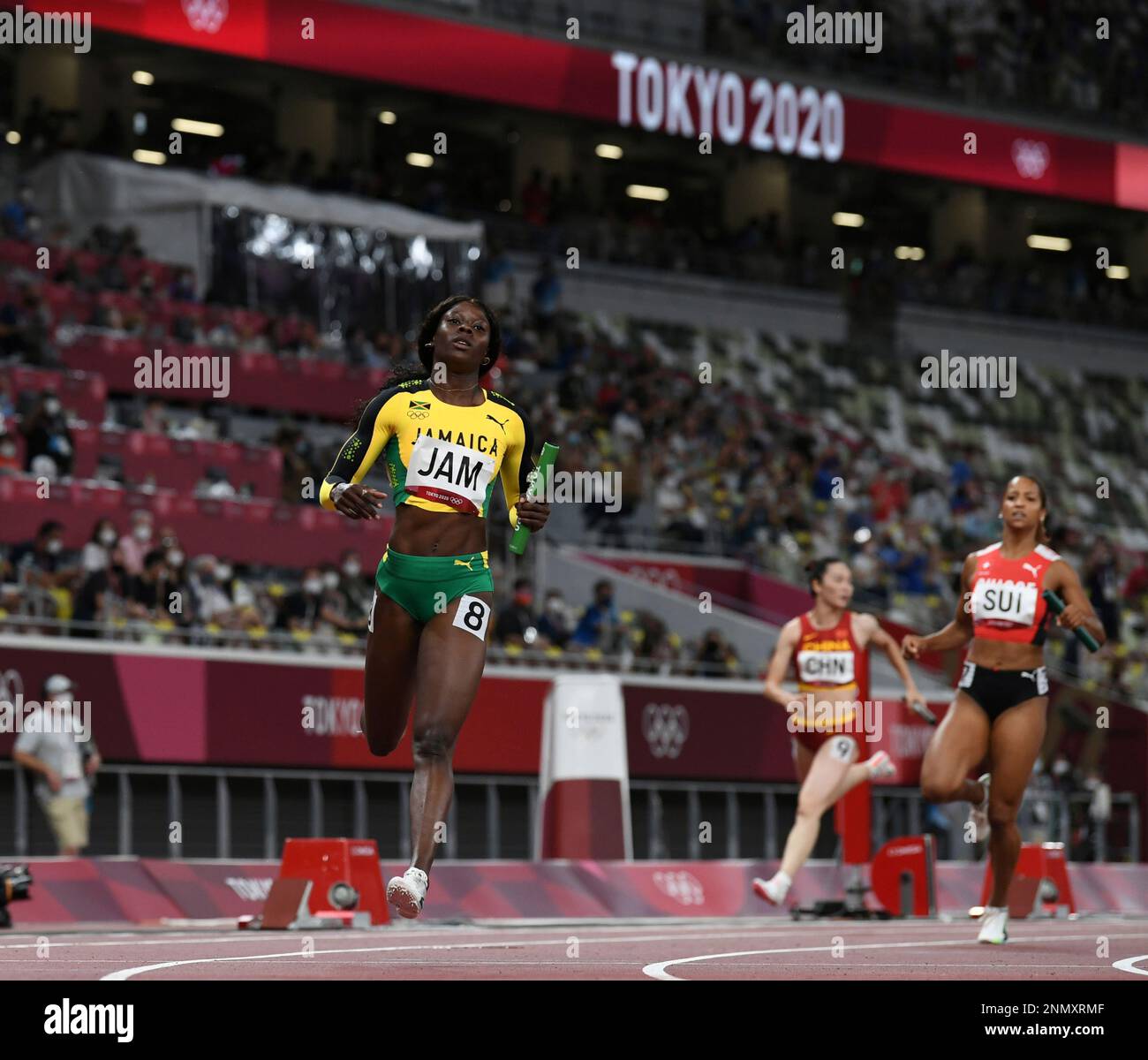 Jamaica's team WILLIAMS Briana ( L, 8 lane) crosses the finish line during the Women's ' 4 x100 ...